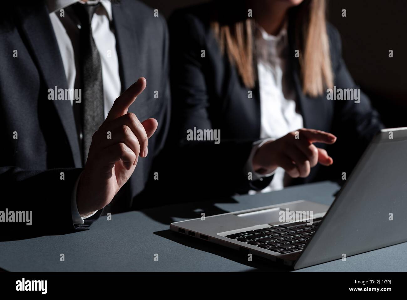 Man And Woman Pointing With Fingers On Important Messages Sitting On ...