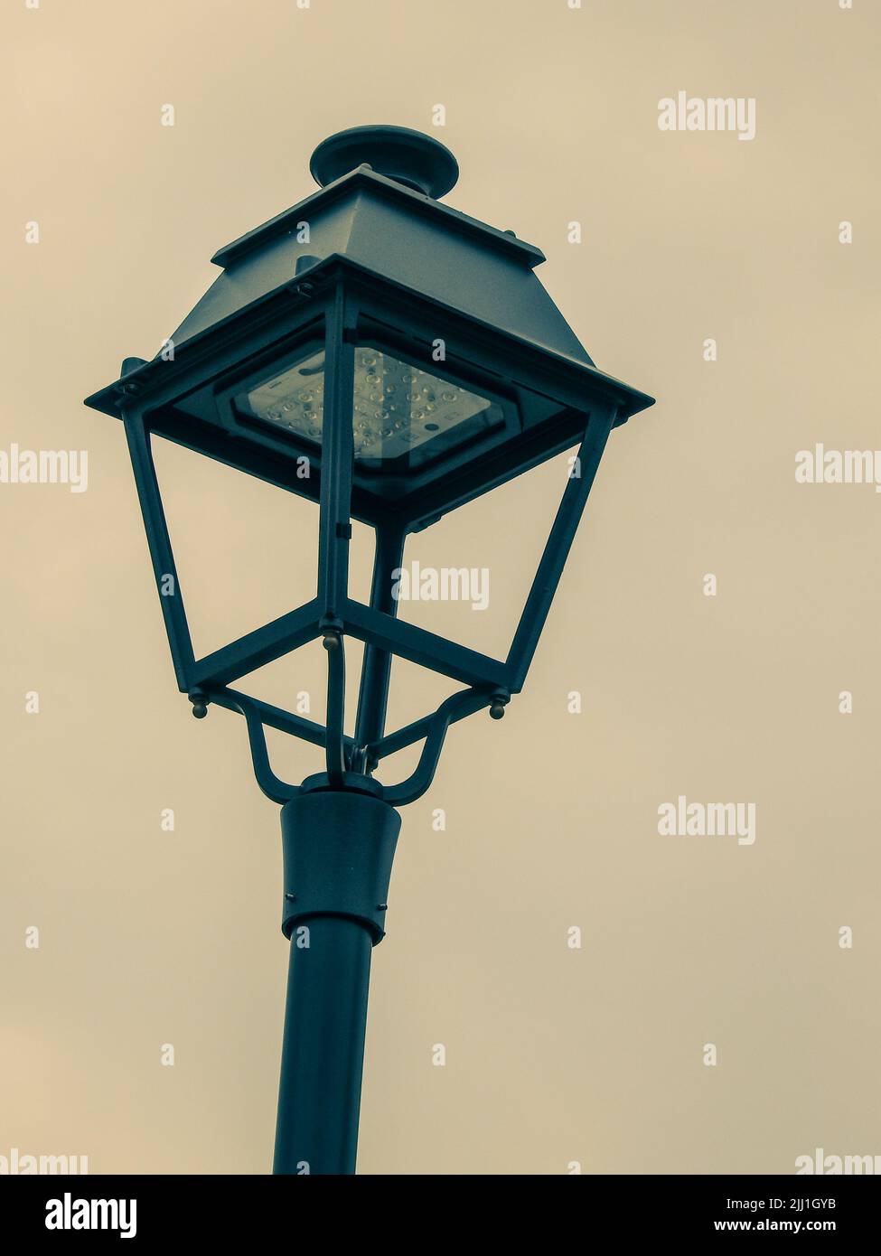 An old street lamp in front of a vintage background Stock Photo - Alamy