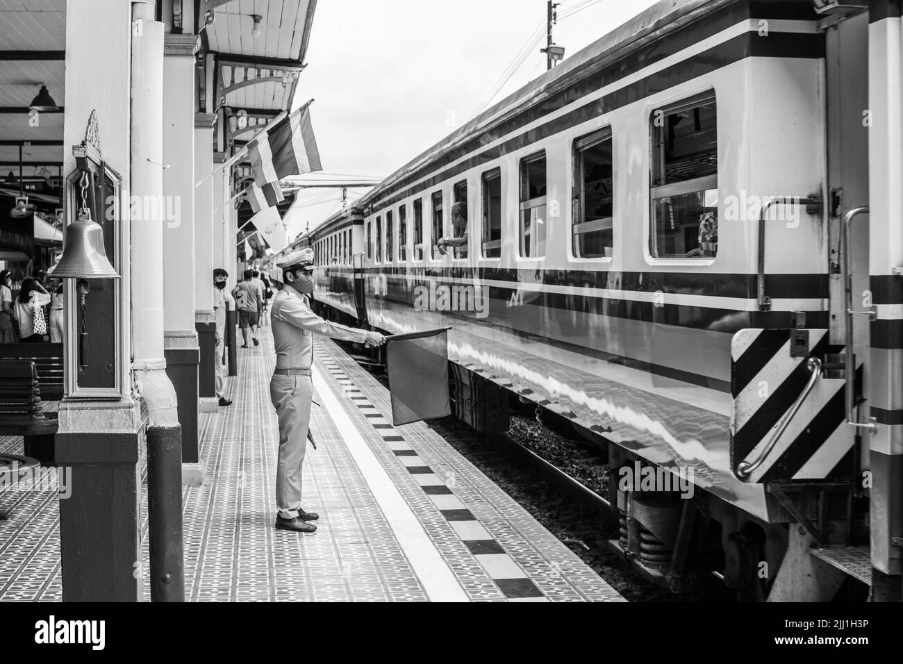 Train conductors and people at the platform of Ayutthaya railway ...