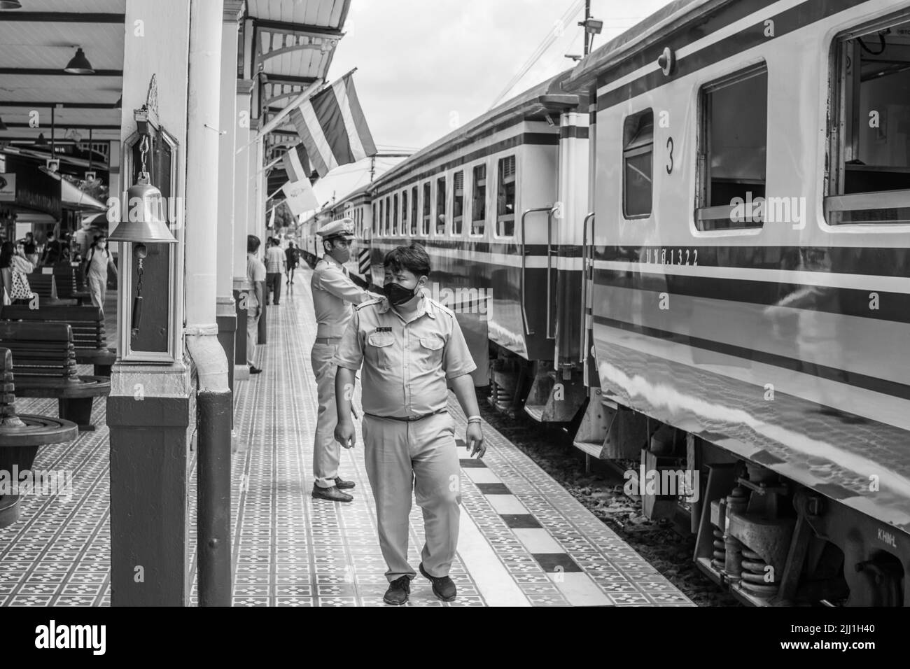 Train conductors and people at the platform of Ayutthaya railway ...