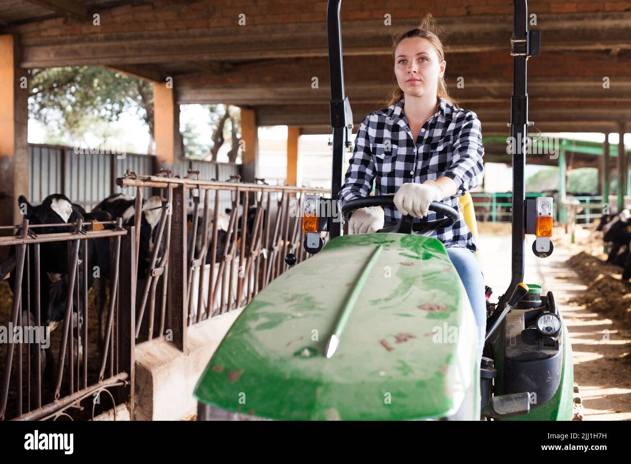 Female farmer working on tractor Stock Photo - Alamy