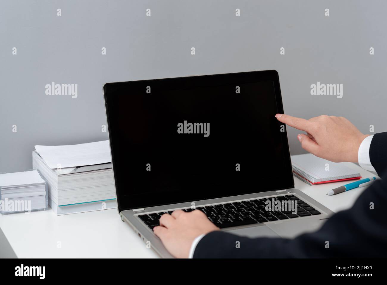 Businesswoman Typing Recent Updates On Lap Top Keyboard On Desk And ...