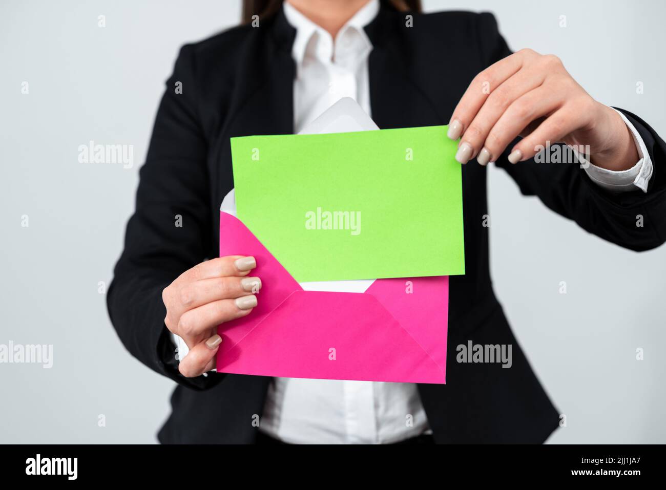 Elegant Businesswoman Putting Important Memorandum In Envelope For ...
