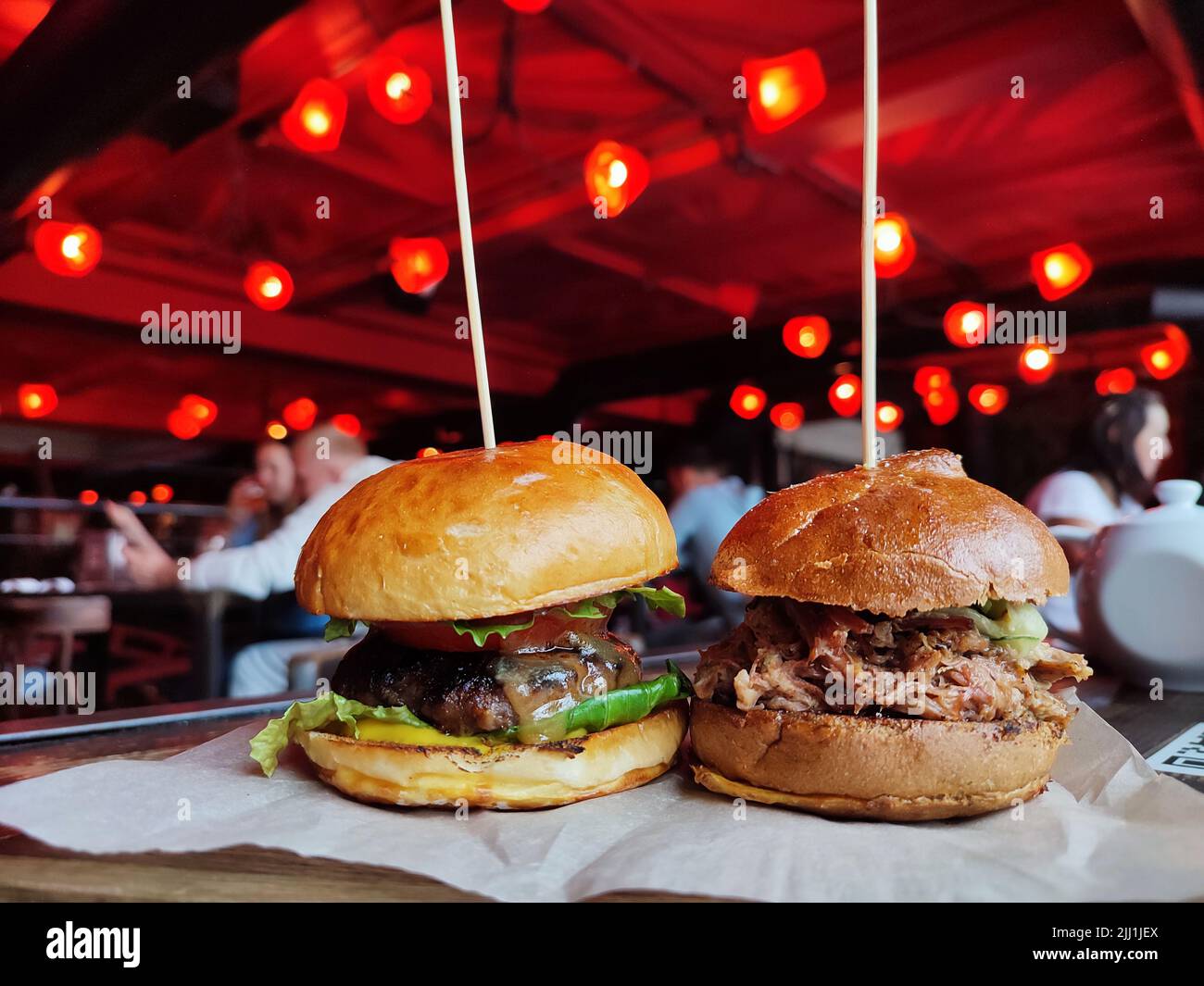 Two juicy burgers with beef meat and chicken meat on fast food ...