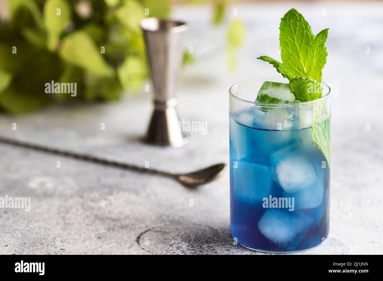 Blue lagoon, Tropical cocktail served with ice cubes decorated with ...
