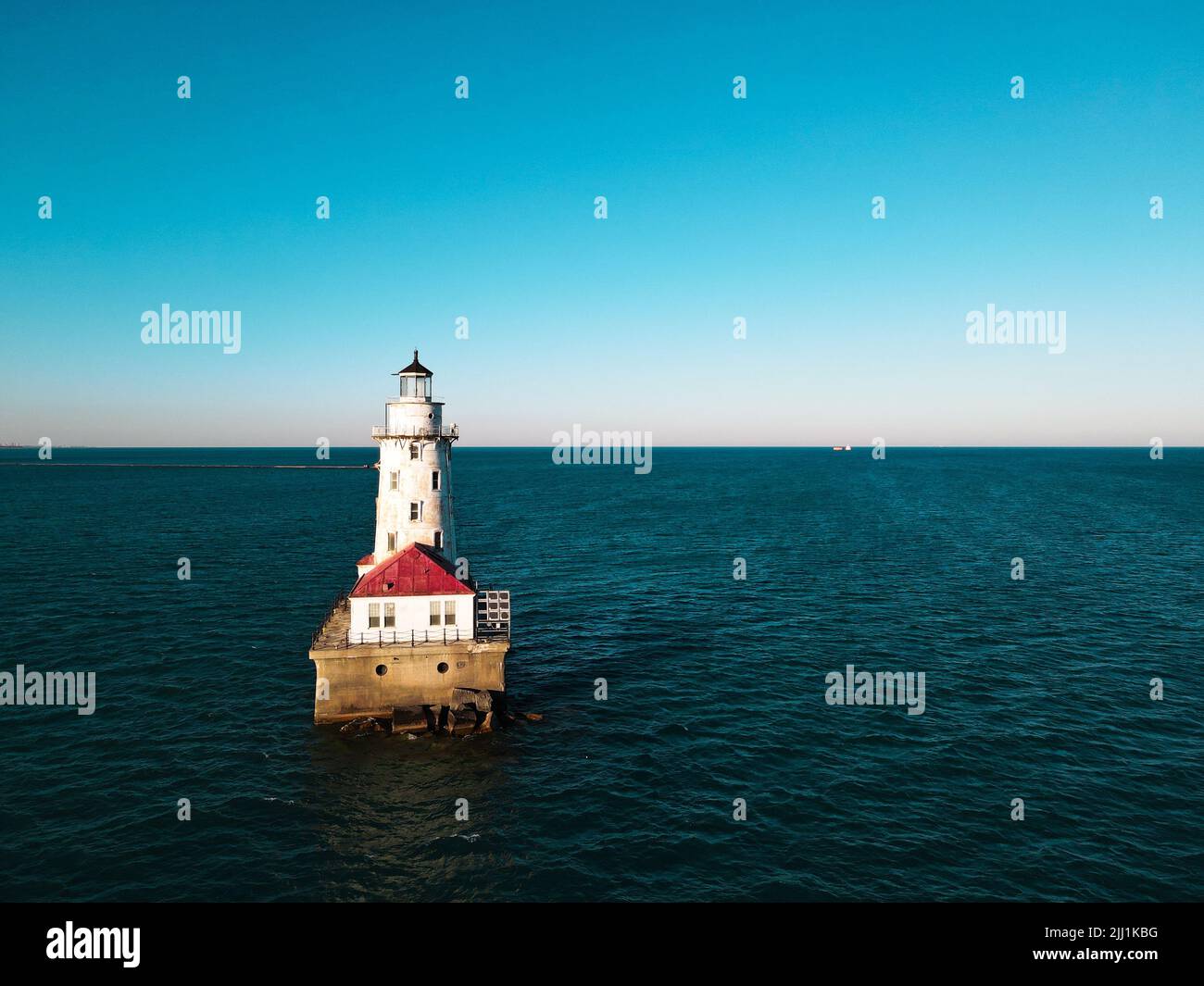 A bird's-eye view of a lighthouse in the middle of an ocean Stock Photo ...