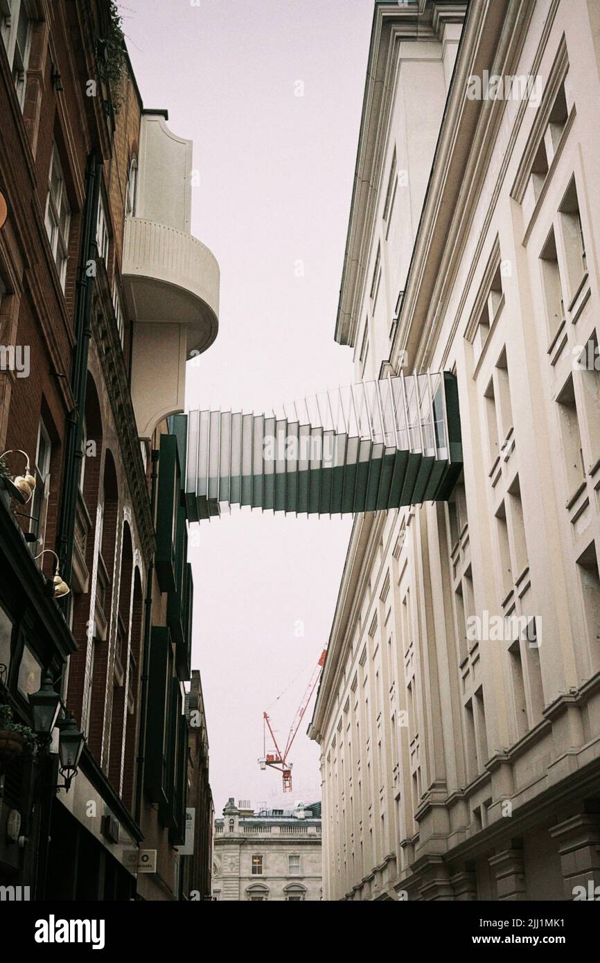 A vertical shot of the Bridge of Aspiration connecting Royal Opera ...