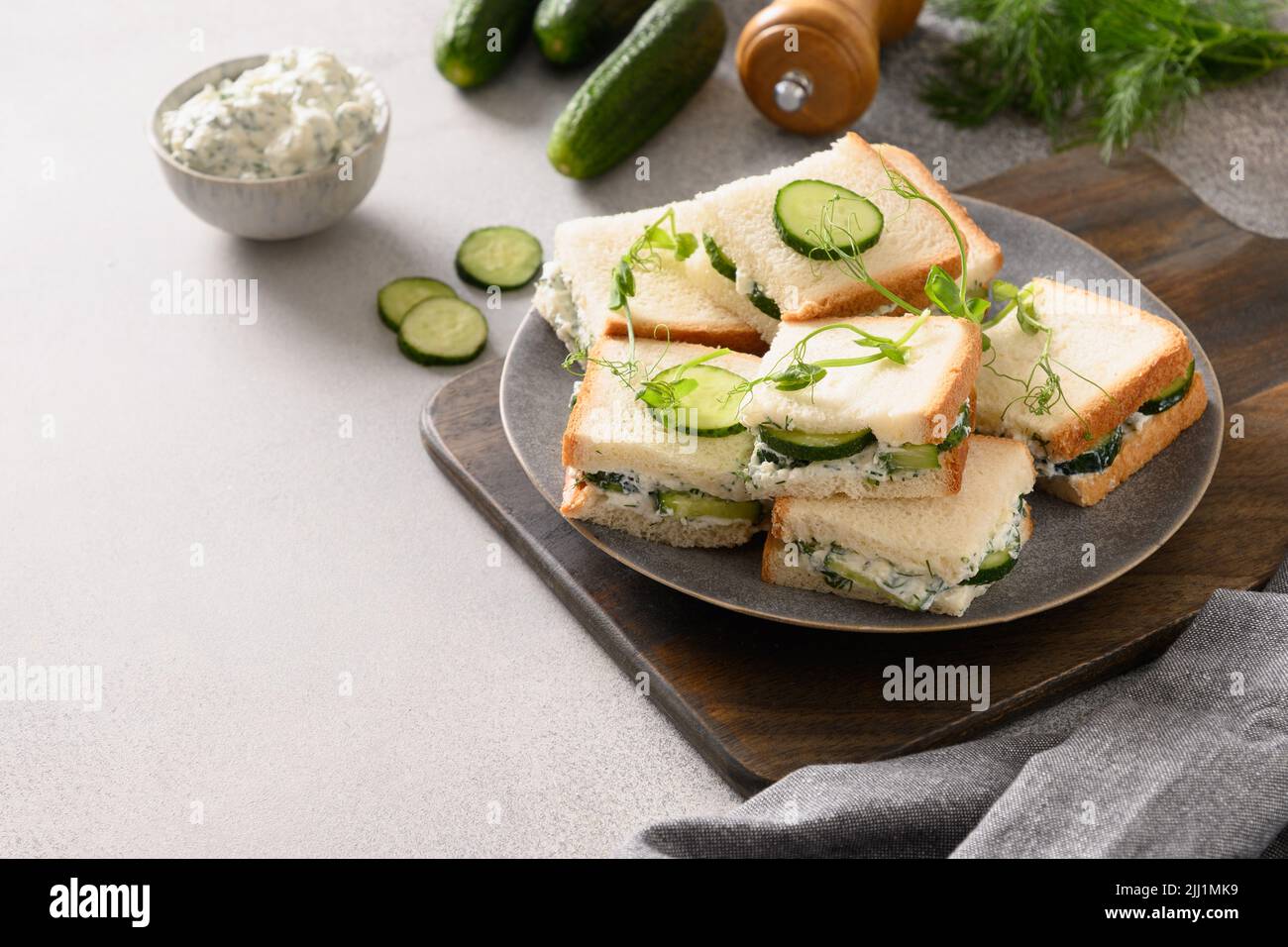 Homemade English tea cucumber sandwiches with ricotta and dill on white ...