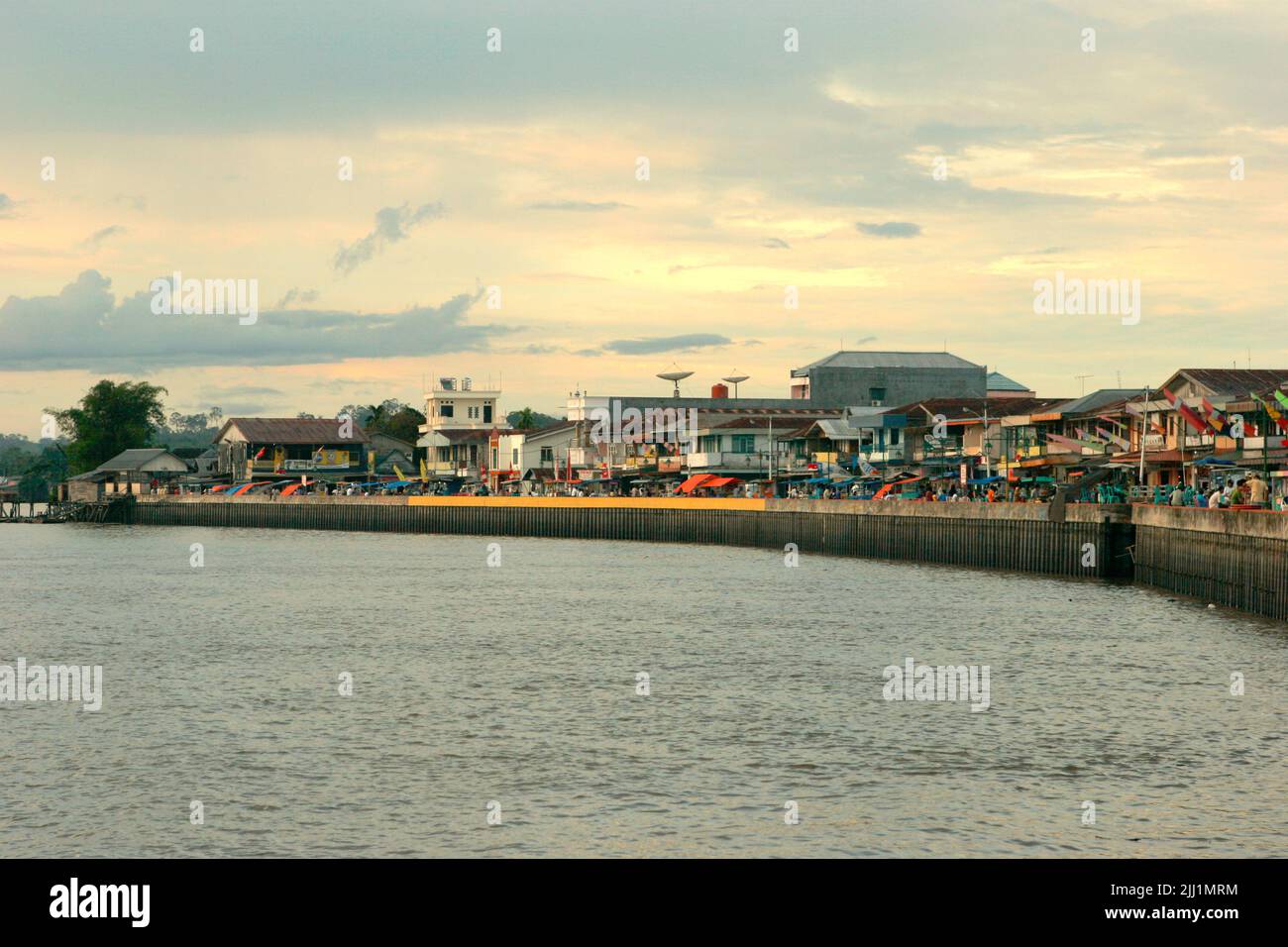 View of street food area on the side of Segah river in Tanjung Redeb ...