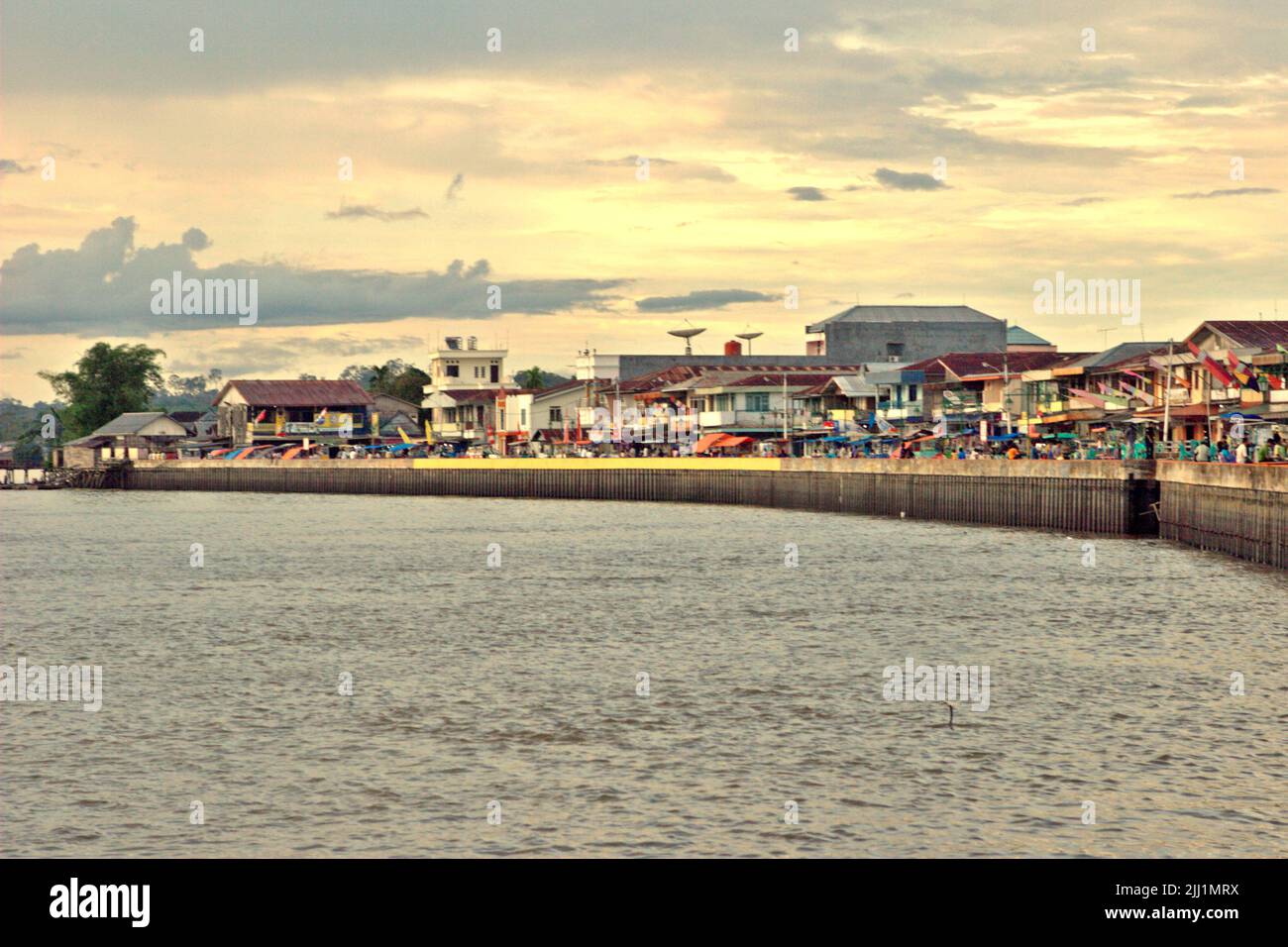 View of street food area on the side of Segah river in Tanjung Redeb ...
