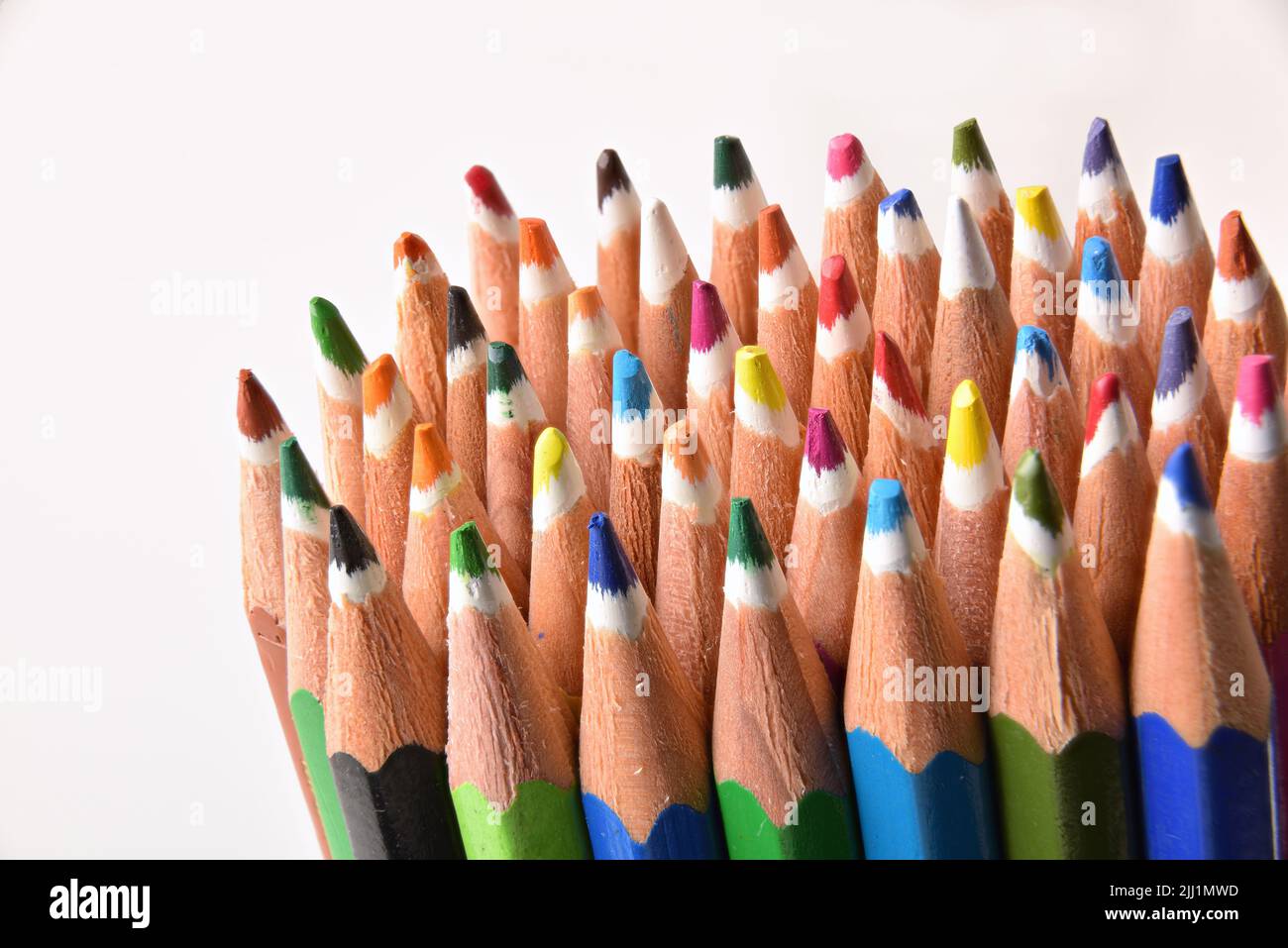 Detail of group of crayon tips on white background. Horizontal ...