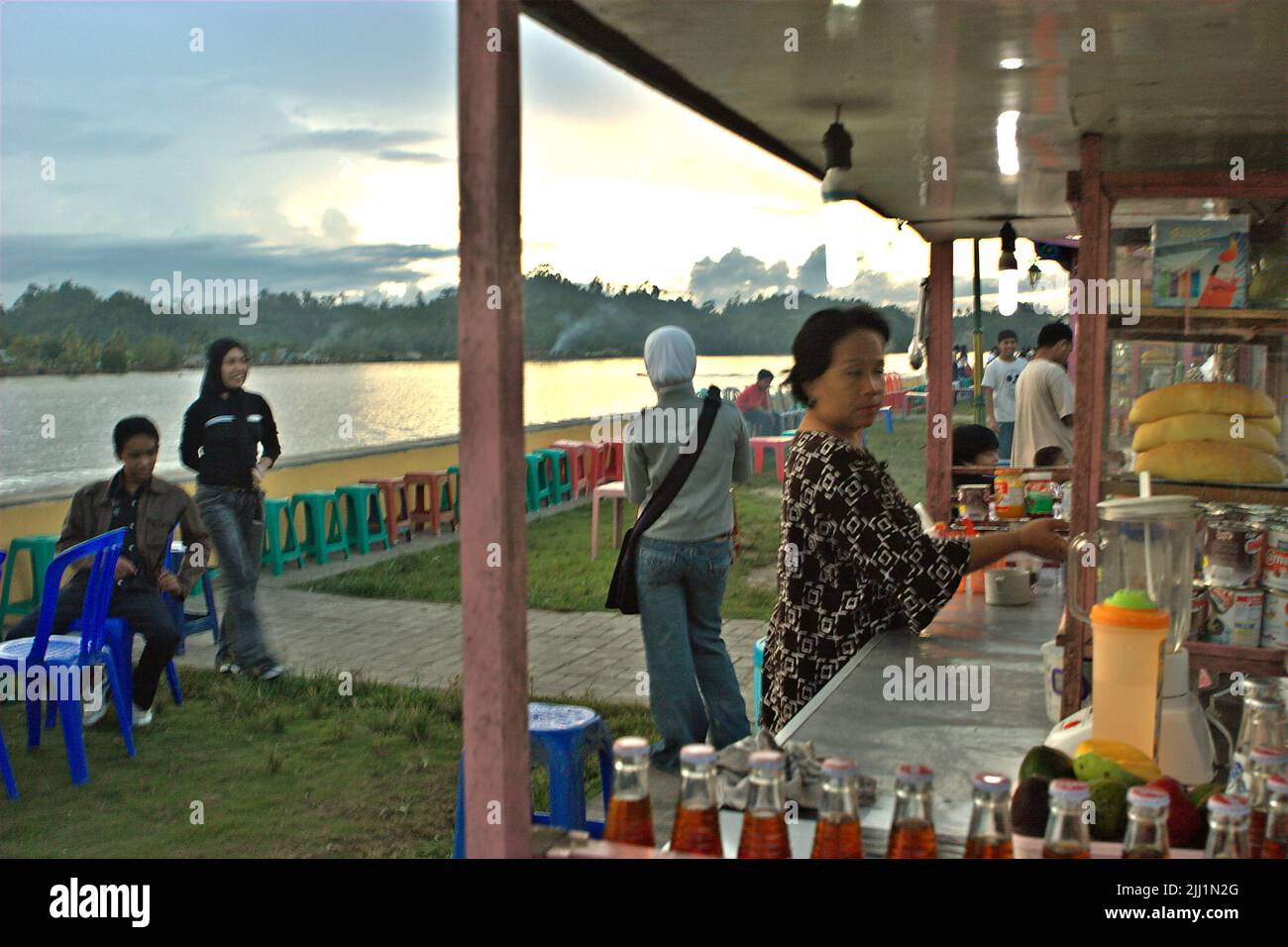 A street food vendor on the side of Segah river in Tanjung Redeb, Berau ...