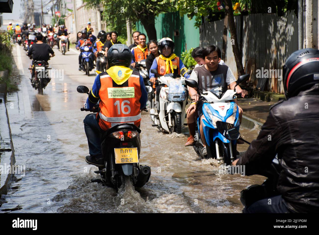 Thai rider riding motorcycle and motorbike taxi on street send receive ...