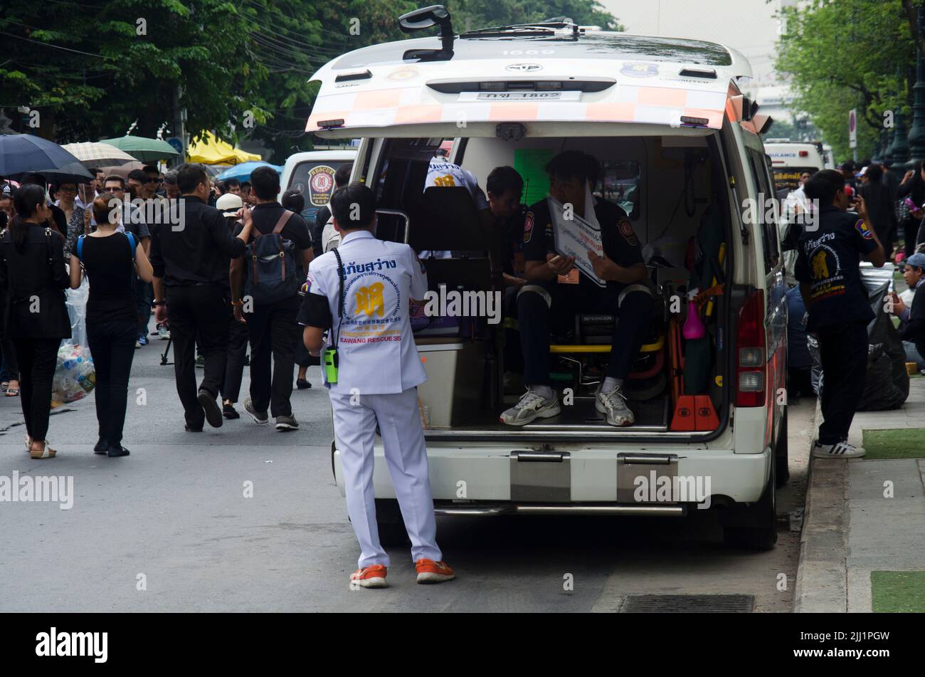 Thai officer operator staff of emergency ambulance vehicle stop waiting ...