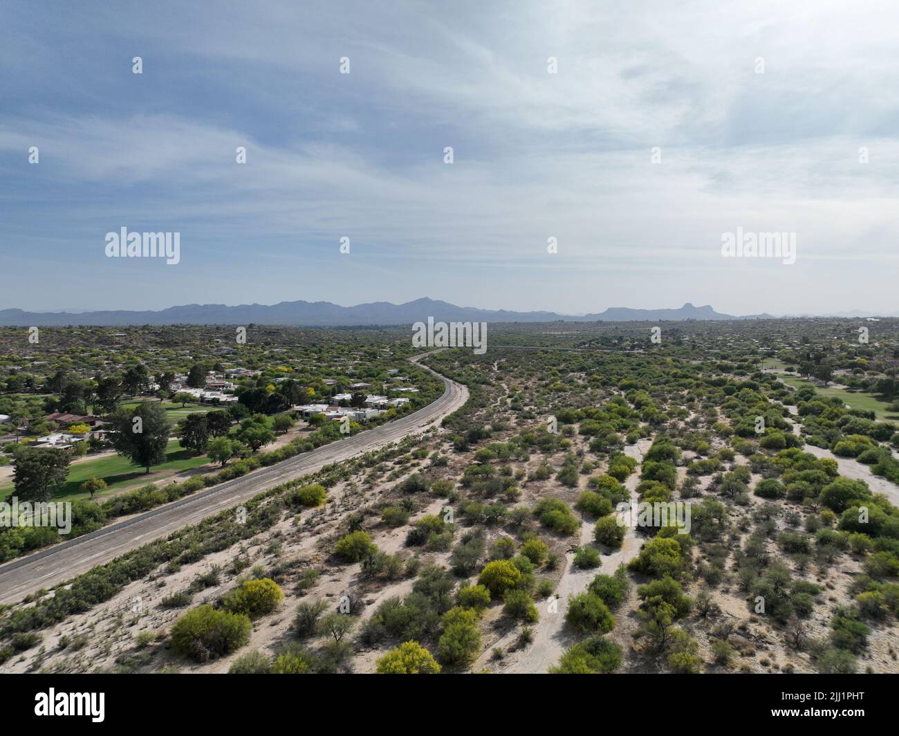 The desert wash vegetation view with and mountain background Stock ...
