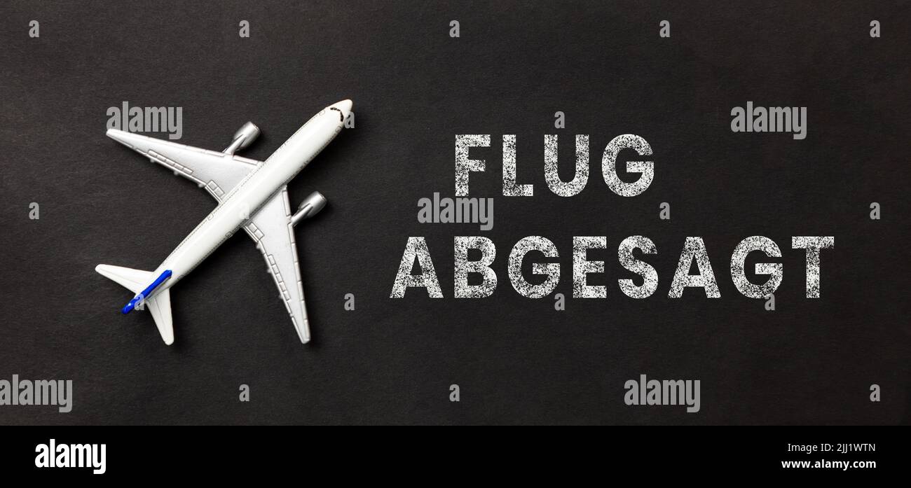 A white plane flight on a black background with German text 'flug ...
