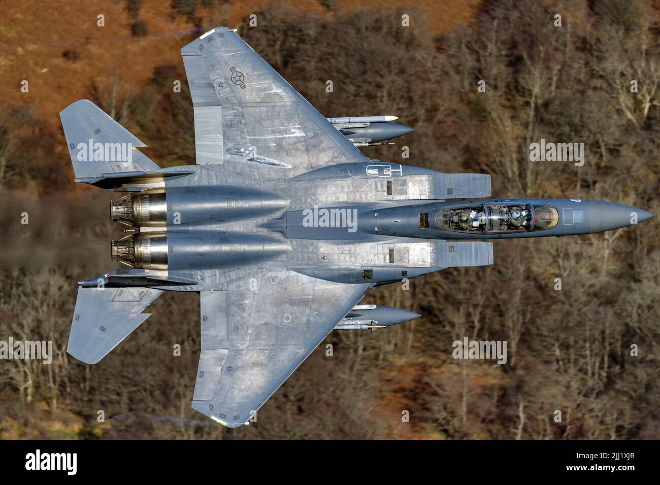 A top view of a fighter jet in flight - F-15E Strike Eagle Stock Photo ...