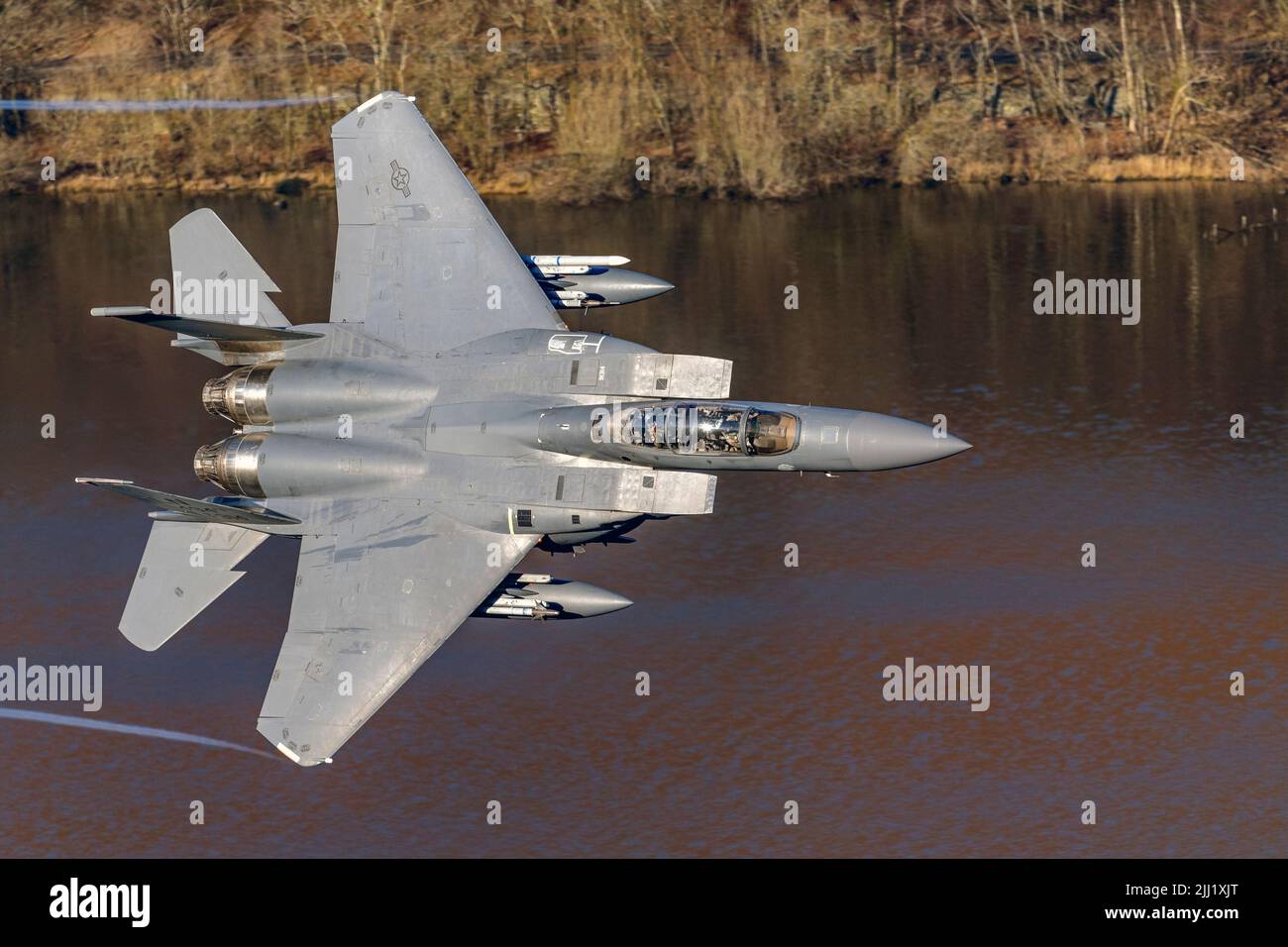 A top view of a fighter jet in flight - F-15E Strike Eagle Stock Photo ...