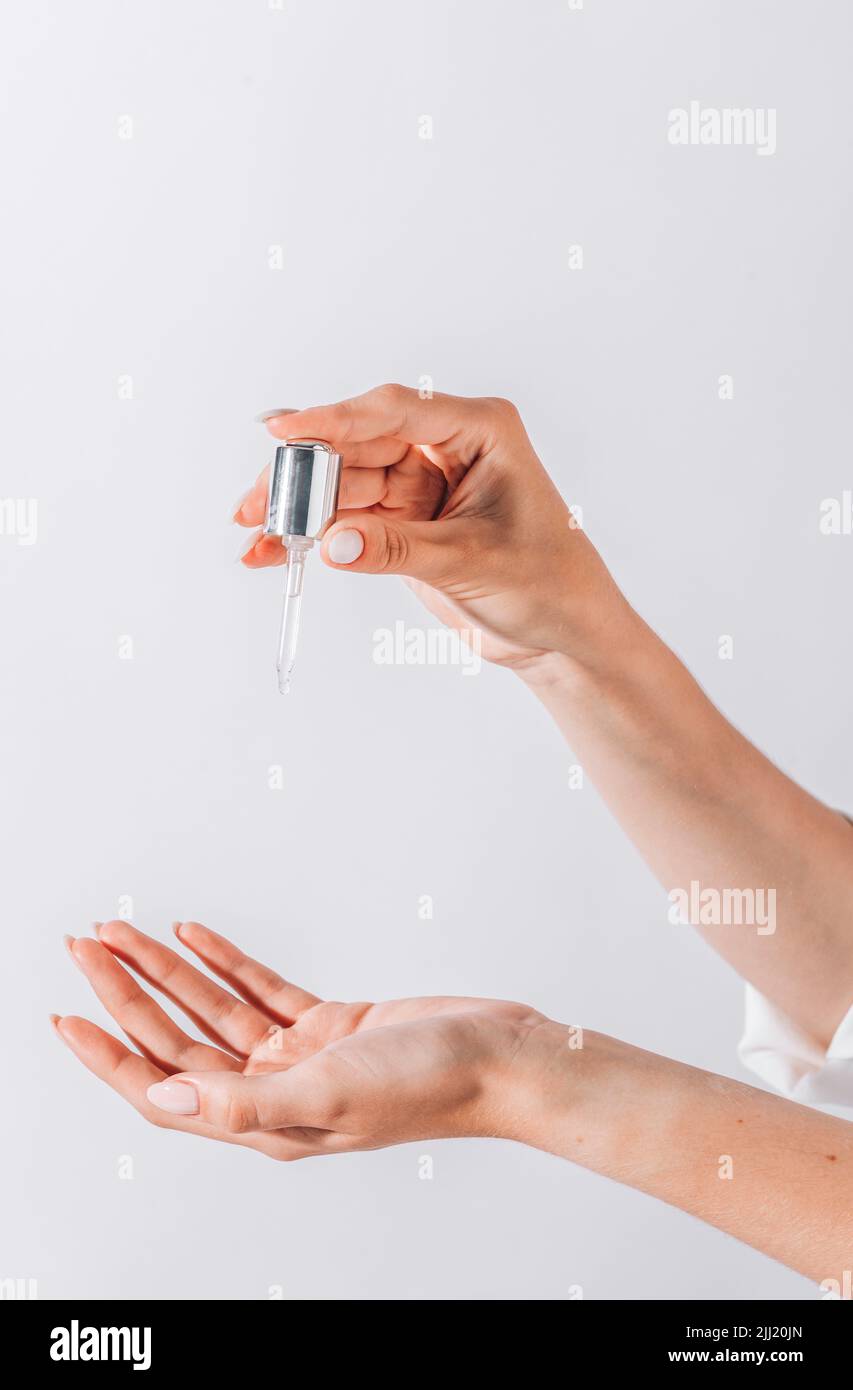 Woman serum face applying hi-res stock photography and images - Alamy