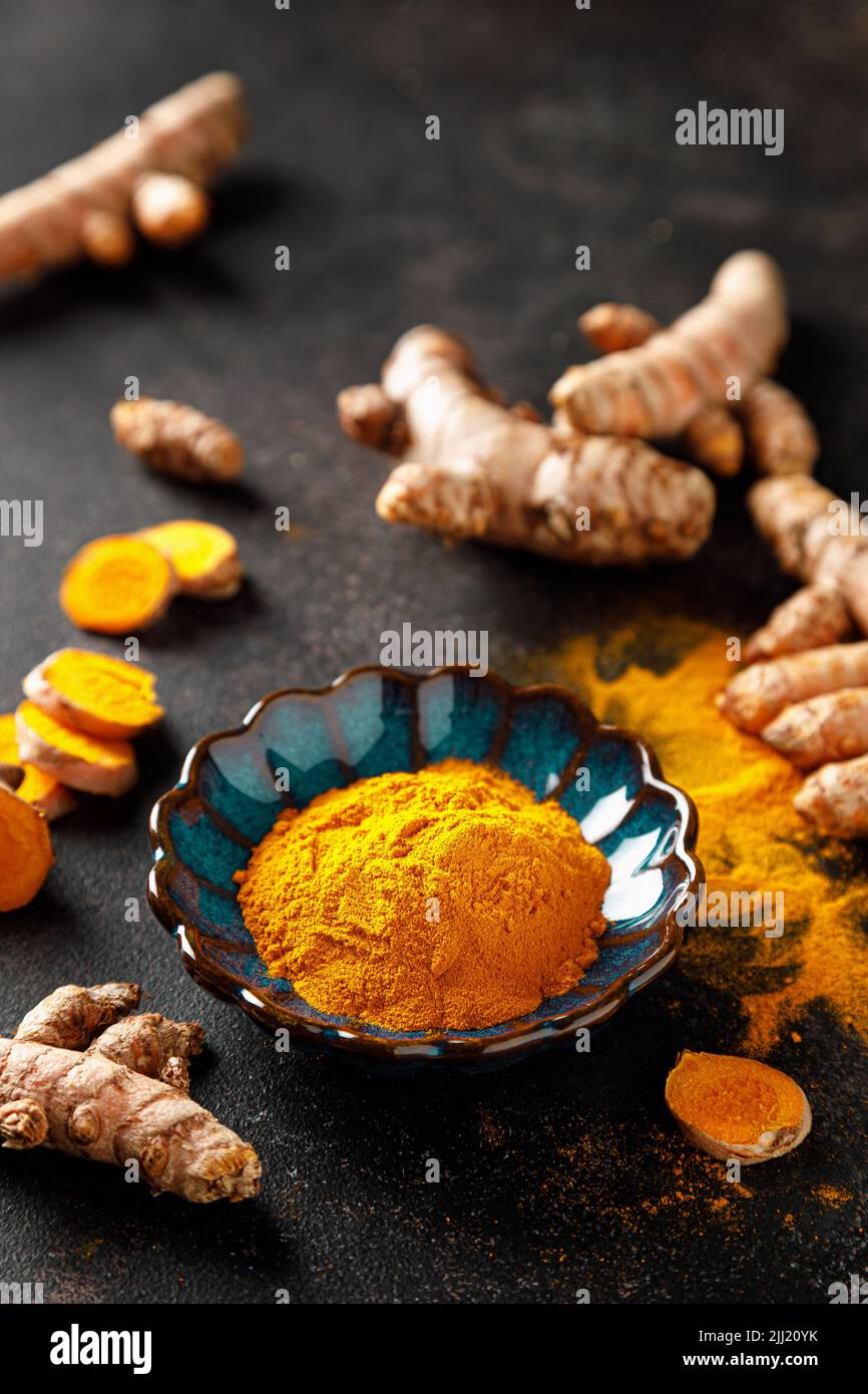 Turmeric. Fresh turmeric root and turmeric, curcumin powder Stock Photo ...