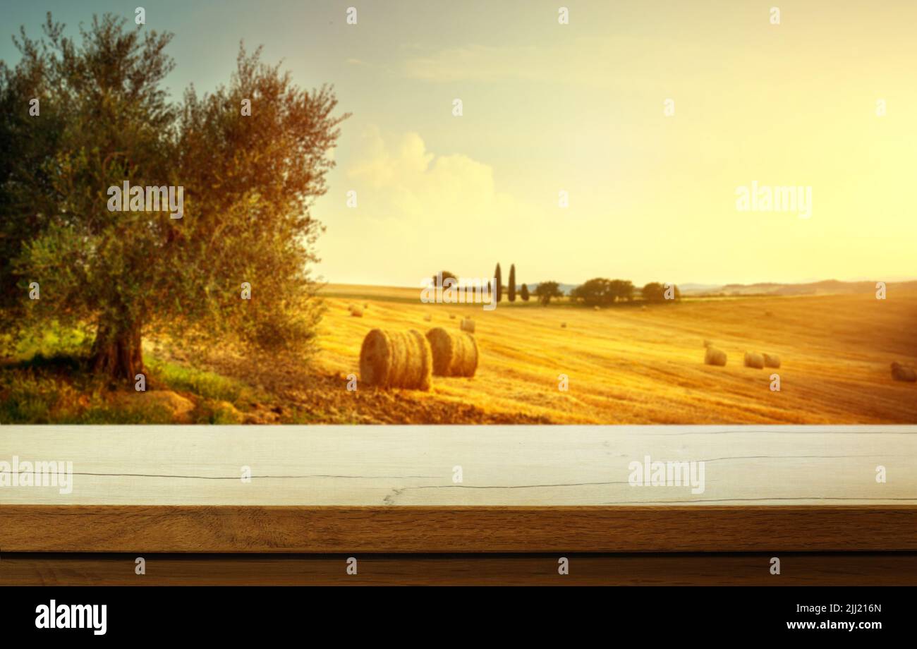 Empty wooden deck table on traditional italian rural landscape ...