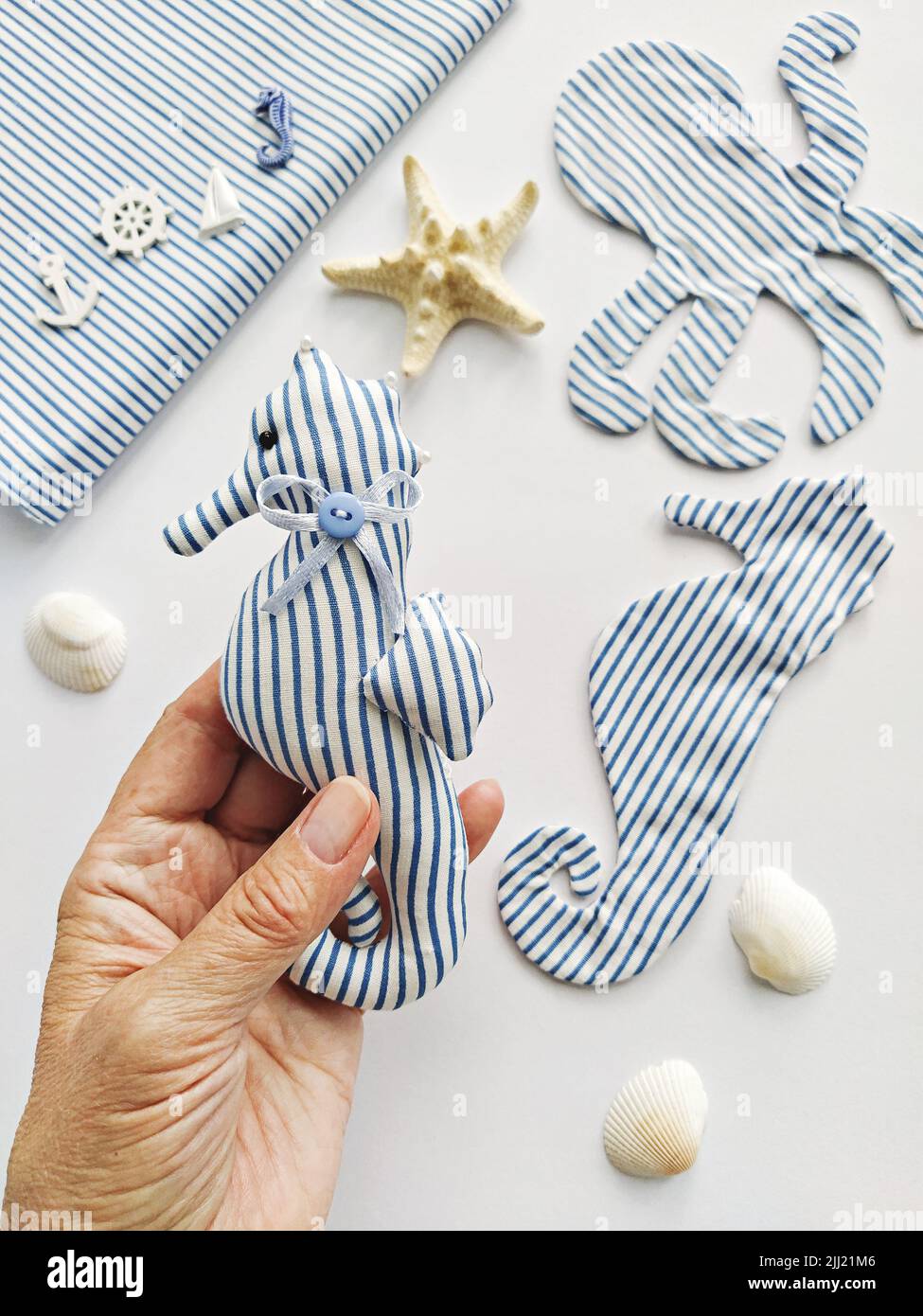 Handmade fabric stuffed toys in hand, sea life octopus and seahorse ...