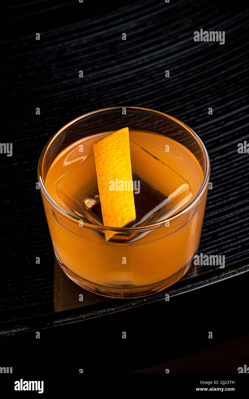 Refreshing citrus and alcoholic cocktail on dark background Stock Photo ...