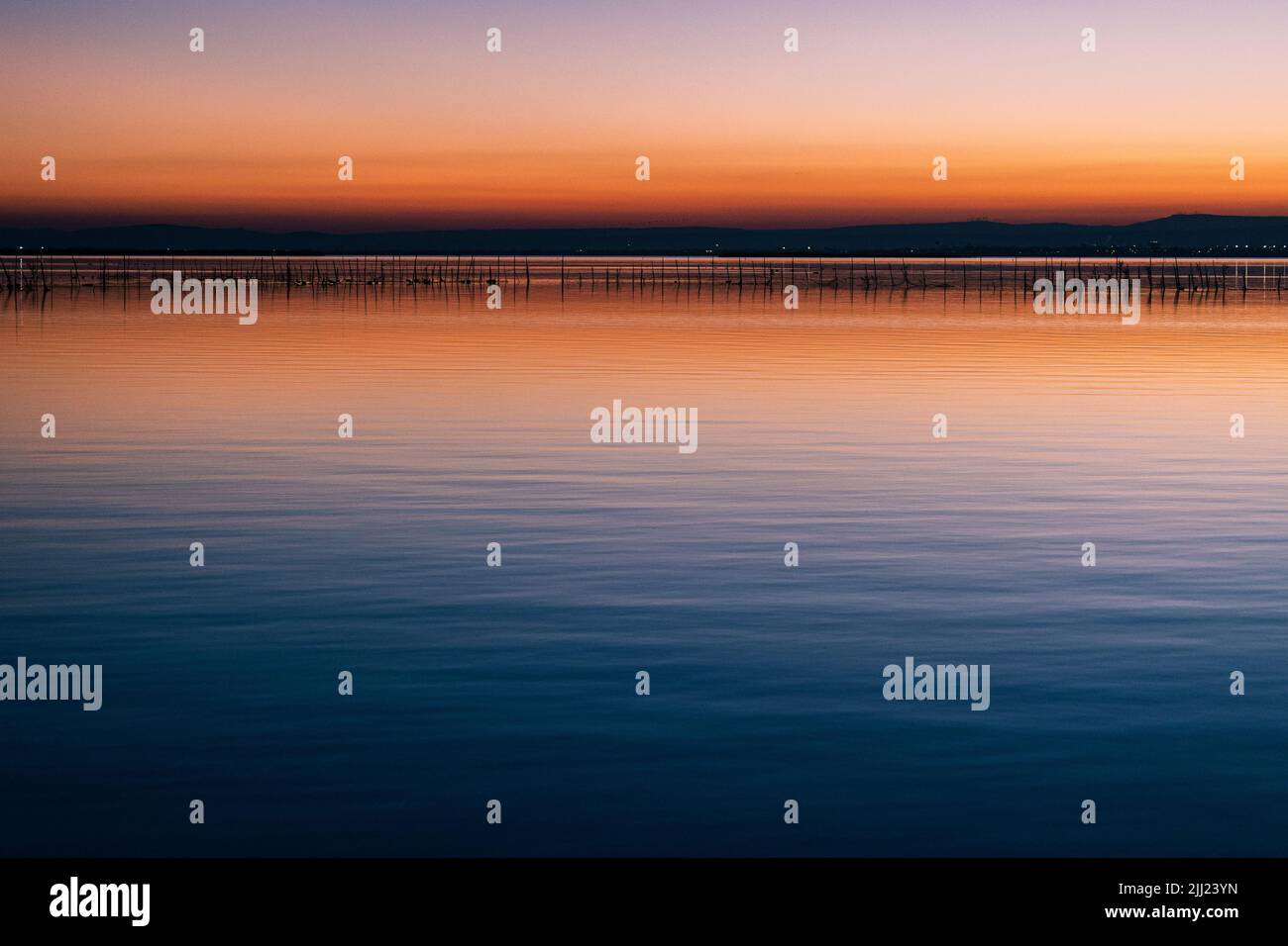 A scenic shot of the calm waters of Albufera Lagoon in Valencia, Spain ...