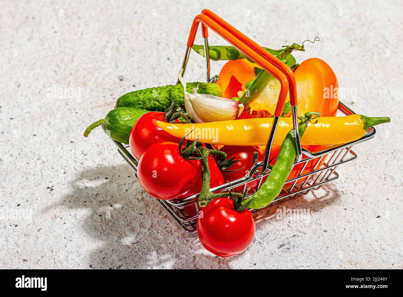 Sale concept. Different vegetables in a basket. Summer harvest, modern ...