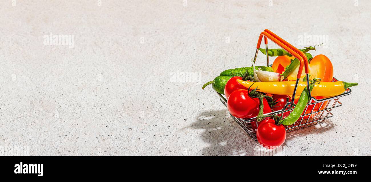 Sale concept. Different vegetables in a basket. Summer harvest, modern ...