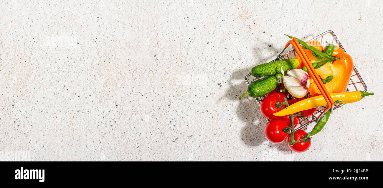 Sale concept. Different vegetables in a basket. Summer harvest, modern ...