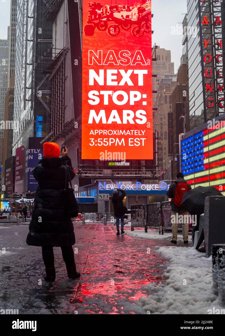 A NASA Mars Rover Landing banner is seen on the One Times Square video ...