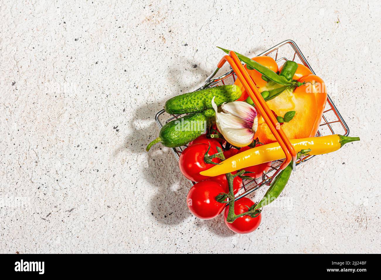 Sale concept. Different vegetables in a basket. Summer harvest, modern ...
