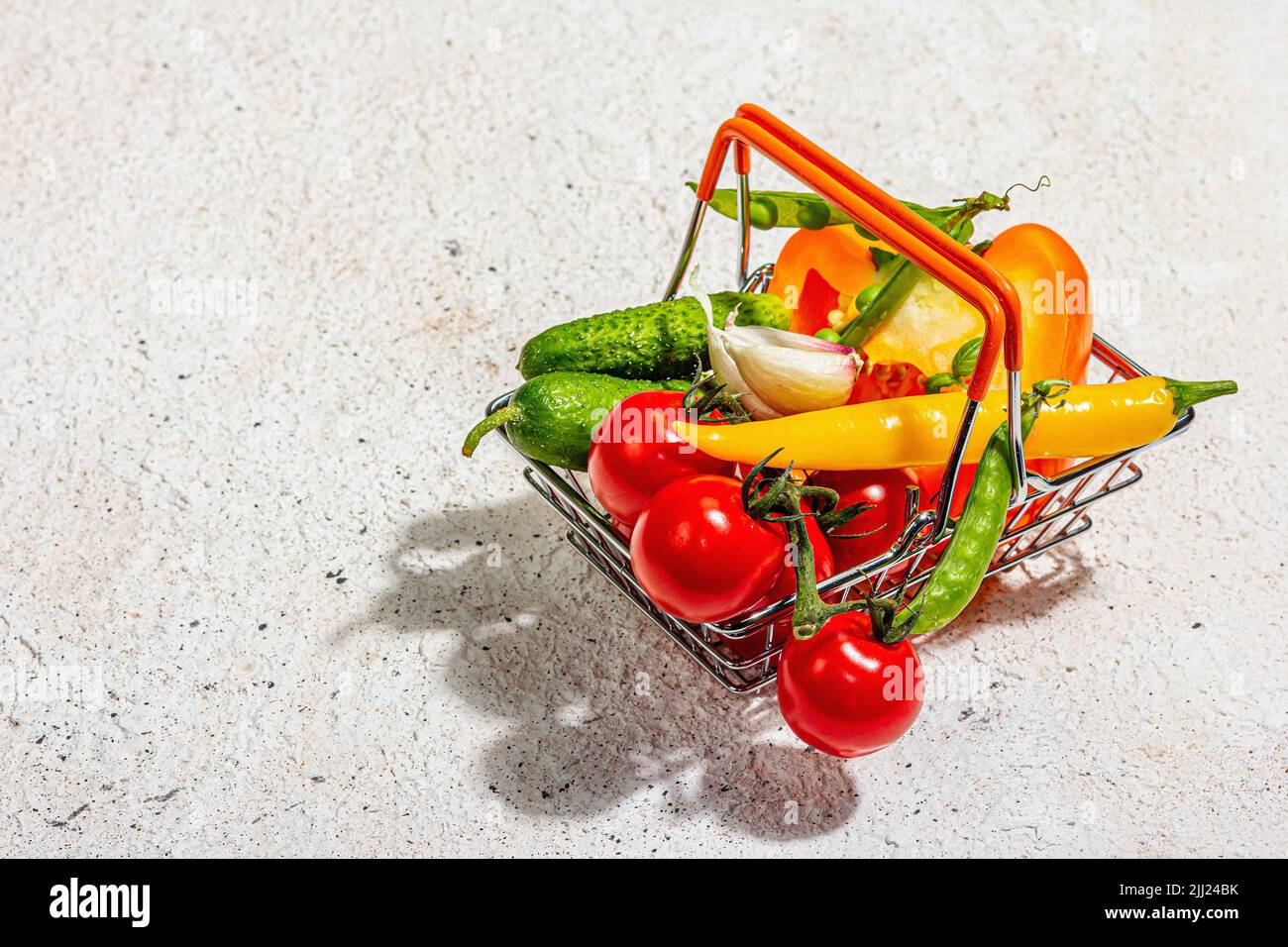 Sale concept. Different vegetables in a basket. Summer harvest, modern ...