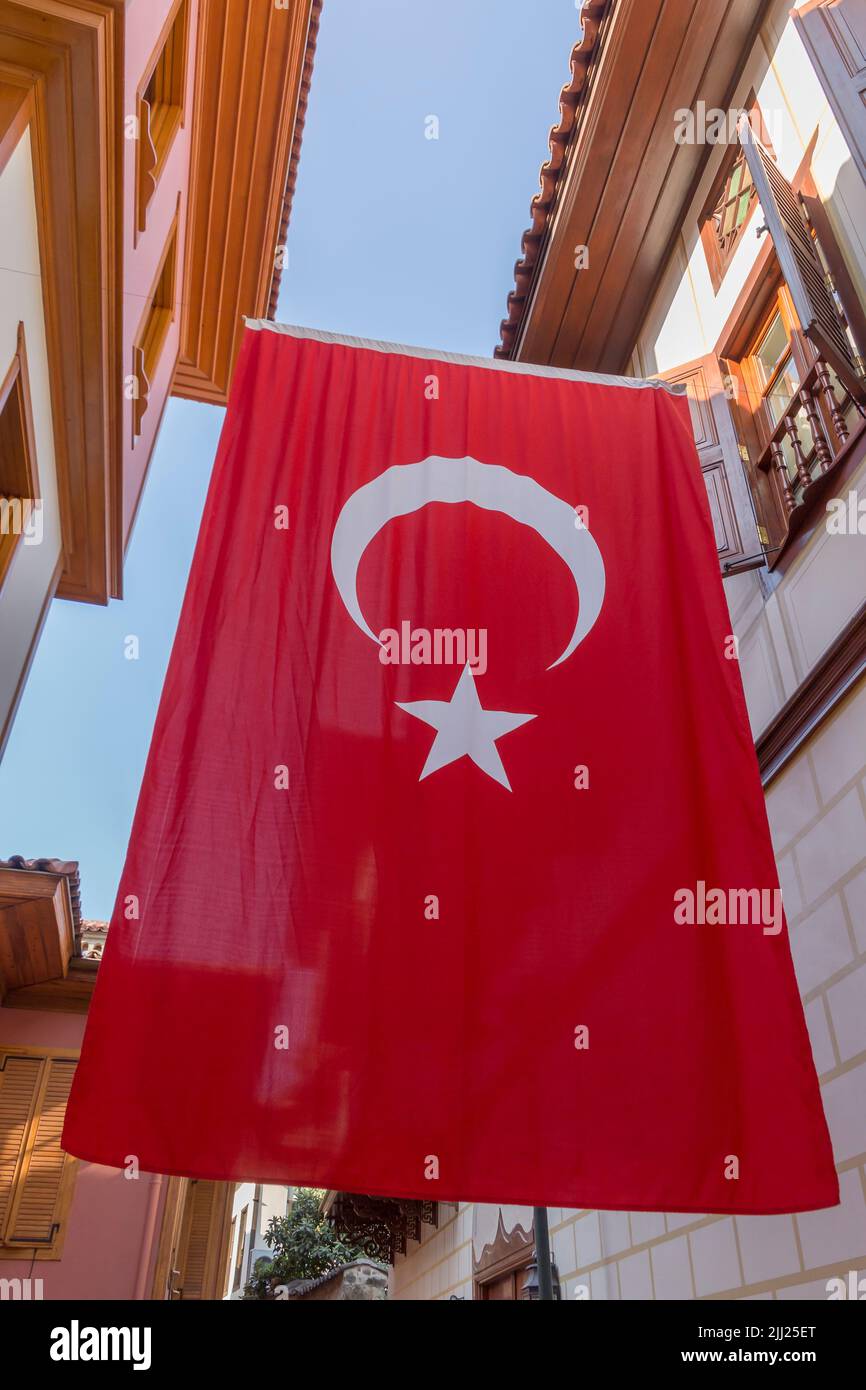 Turkish flag hanging between buildings in old town in Antalya Stock ...