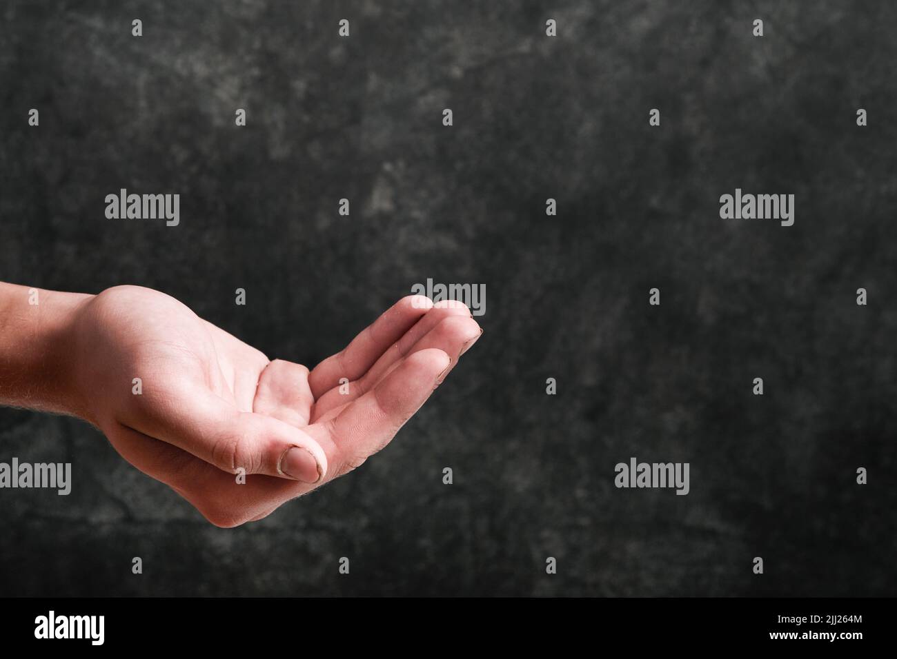 Empty hand of a poor hungry man outstretched for alms. Problems with ...