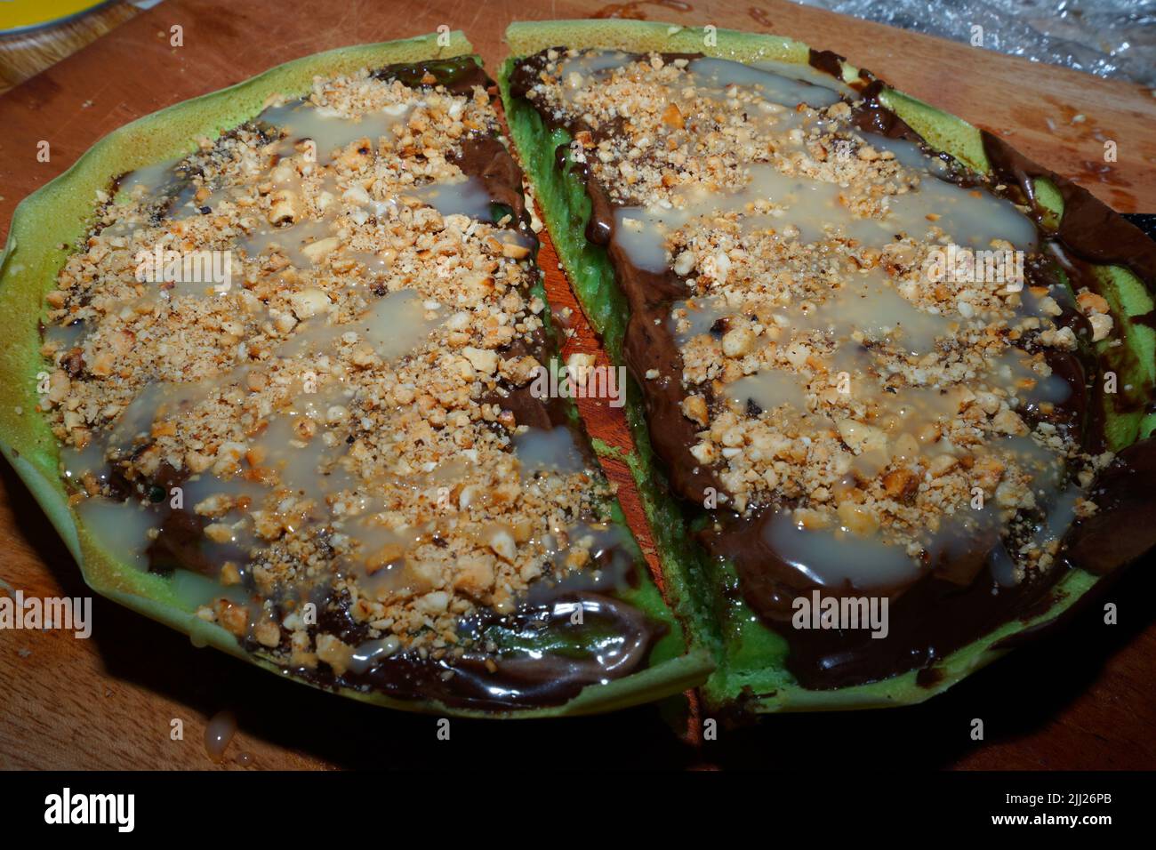 Pandan pancake with chocolate and peanut Stock Photo - Alamy