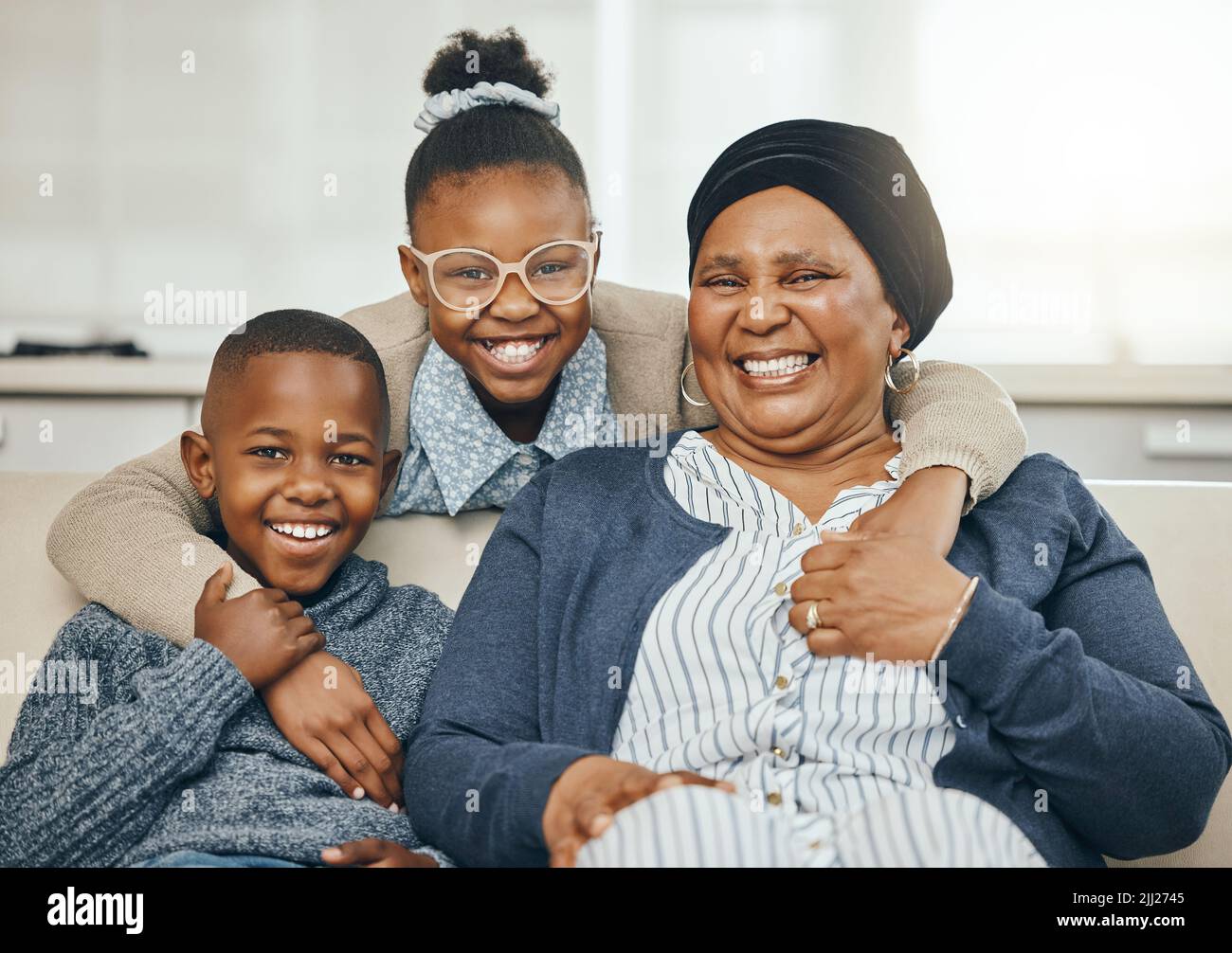 Theres no stronger love than a grandmas. a grandmother bonding with her grandkids on a sofa at ...