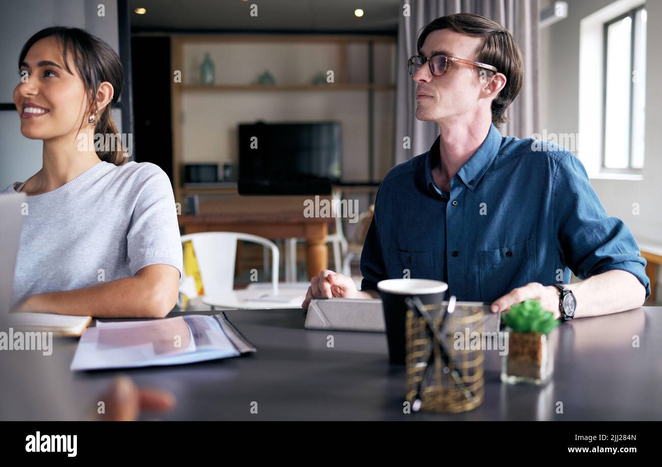 Teamwork is the ability to work together. a two businesspeople having a ...
