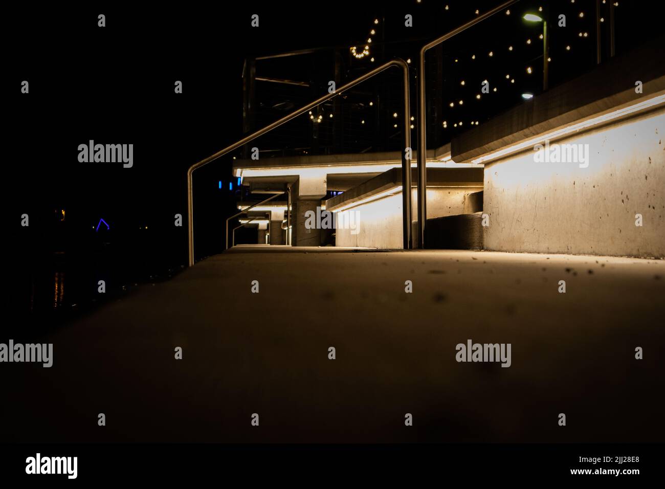 An illuminated concrete structure at night Stock Photo - Alamy