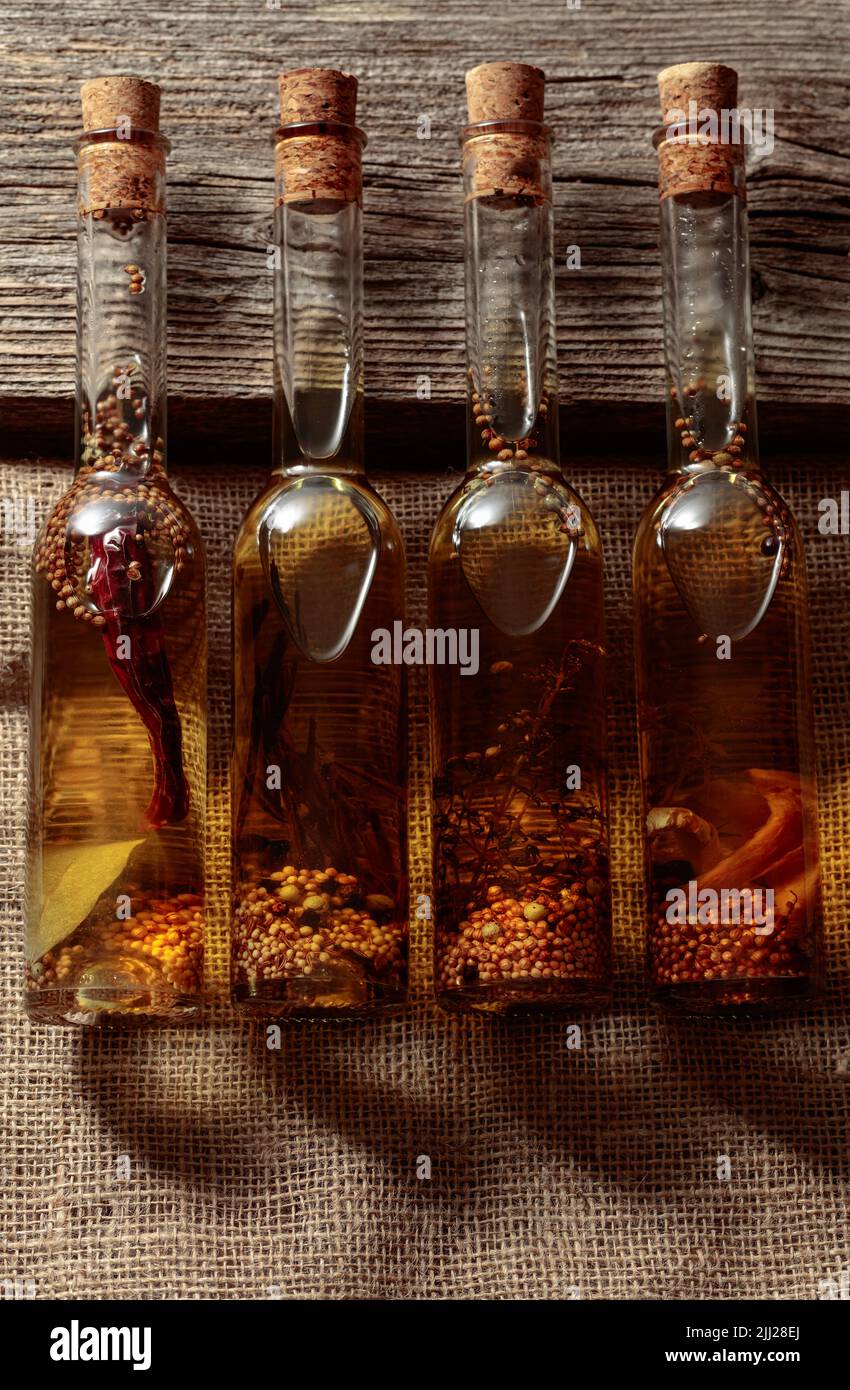 Homemade olive oil with herbs and spices in small bottles Stock Photo ...
