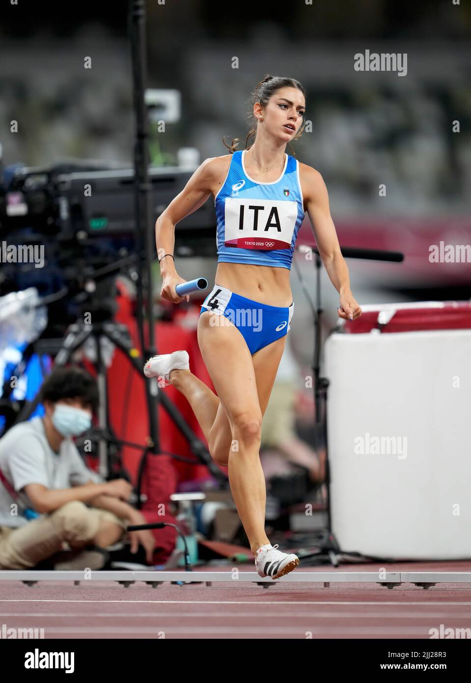 Rebecca Borga participating in the 4x400 meter relay at the 2020 Tokyo ...