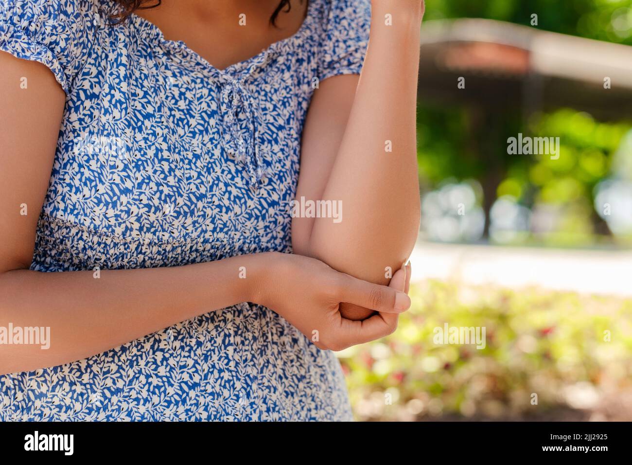 Young beautiful woman wearing summer dress on city park, outdoors ...