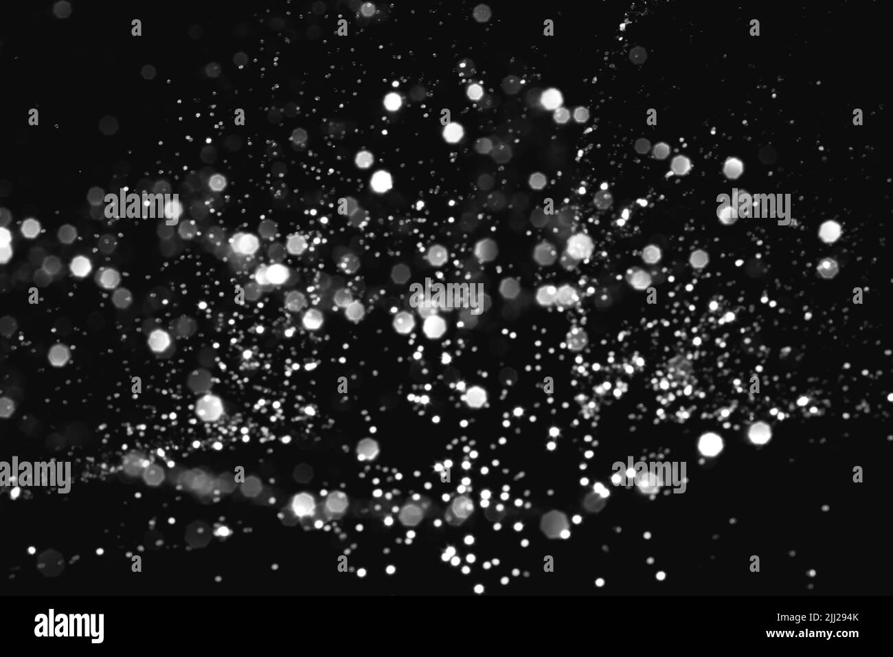 White gray blurred abstract bokeh lights on black background. Snowy ...