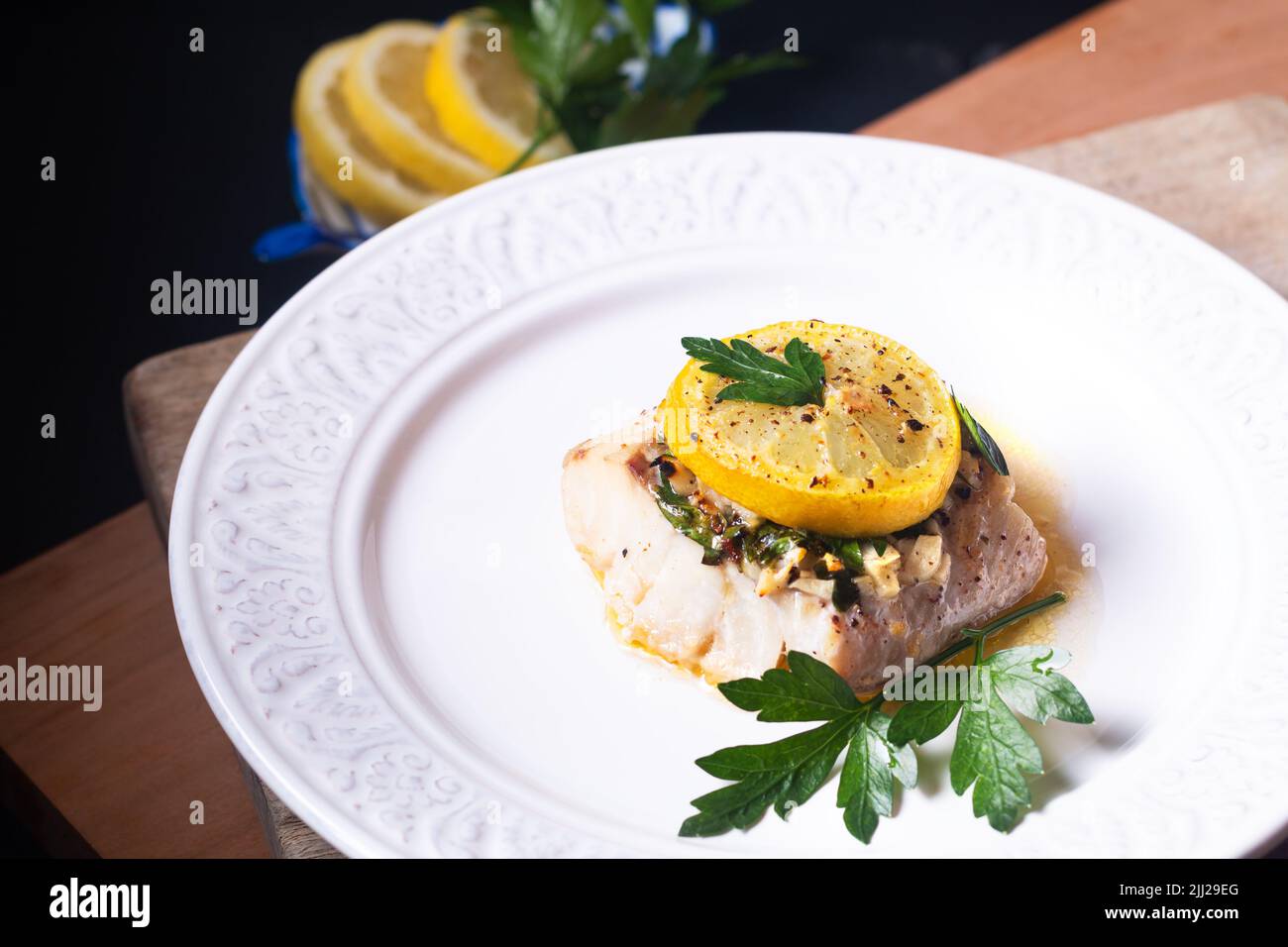 Healthy Food concept Homemade Lemon garlic butter Baked Cod fish on ...