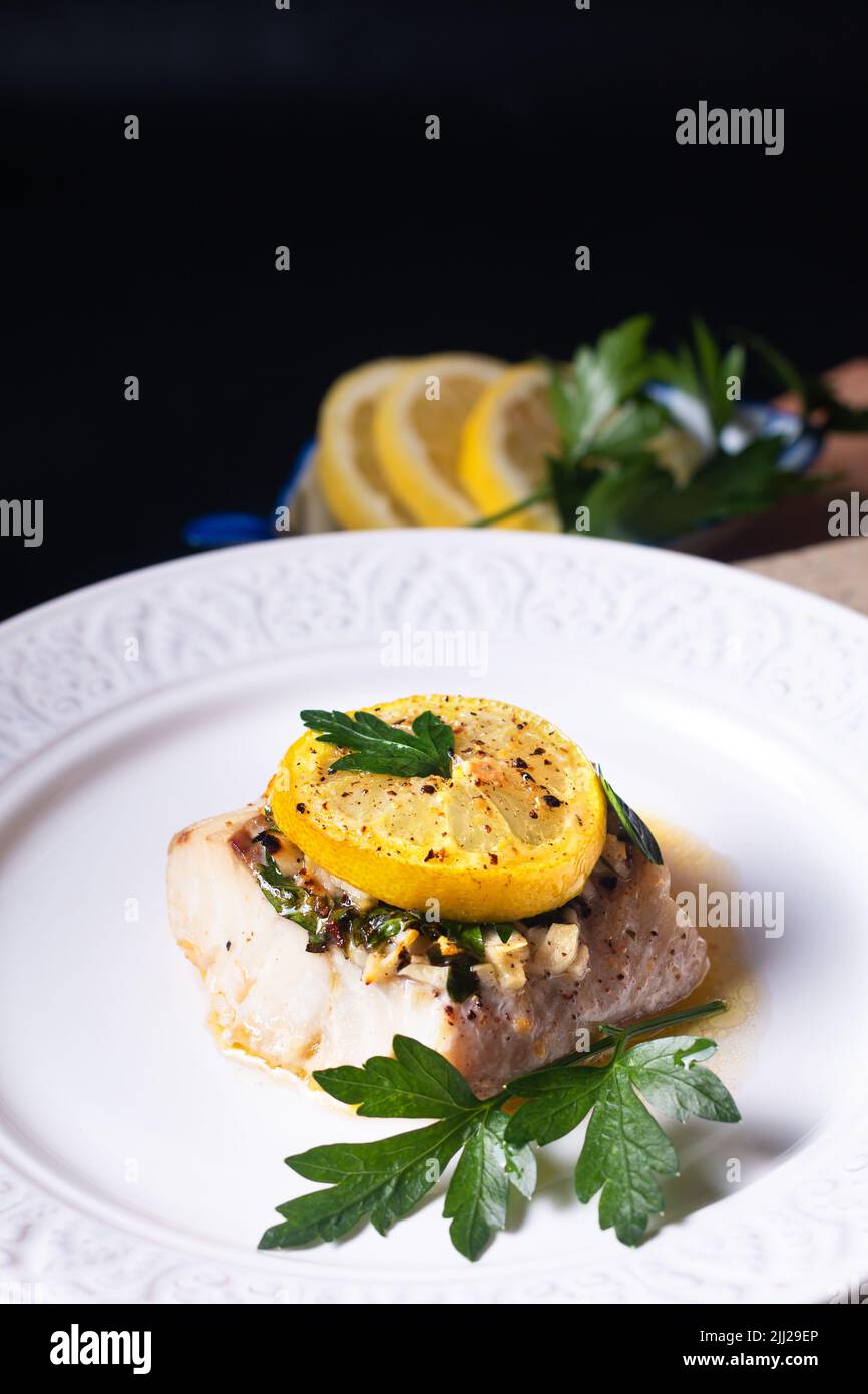 Healthy Food concept Homemade Lemon garlic butter Baked Cod fish on ...