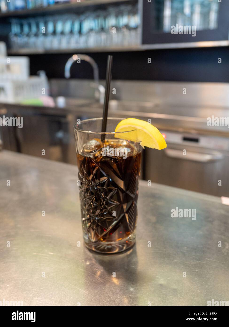 very cold cola on a white background with ice and lemon Stock Photo - Alamy