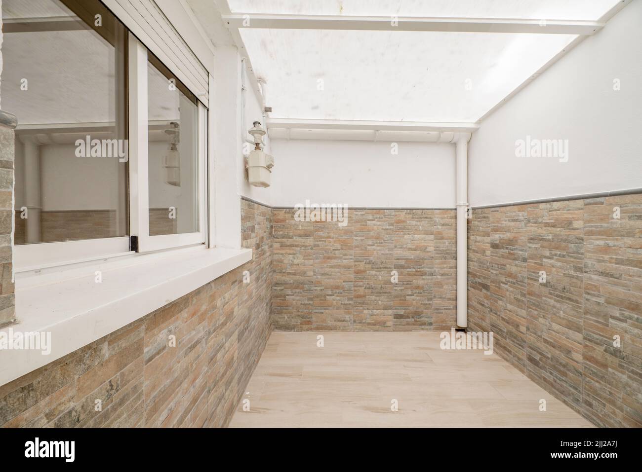 Drying terrace with white aluminum windows and glass in the kitchen of ...