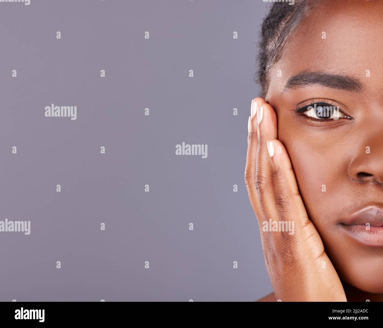 No more skin problems. a beautiful young woman posing against a studio ...