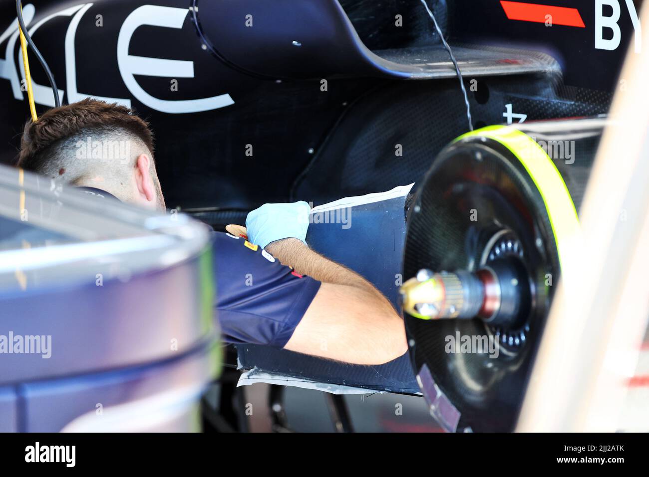 Red Bull Racing mechanic working on the Red Bull Racing RB18 sidepod ...